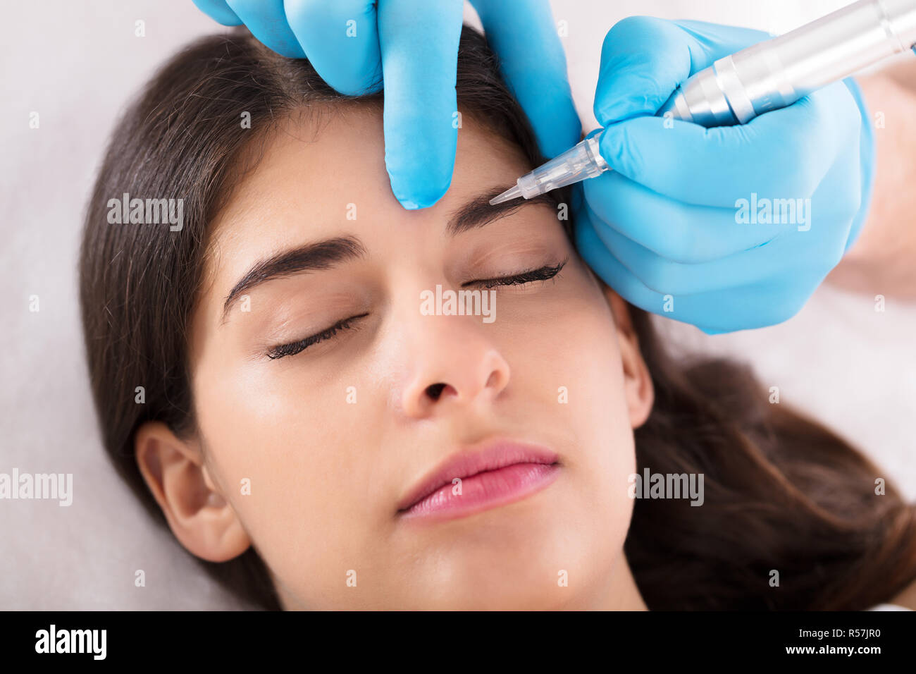 Woman permanent makeup on eyebrows hi-res stock photography and images ...