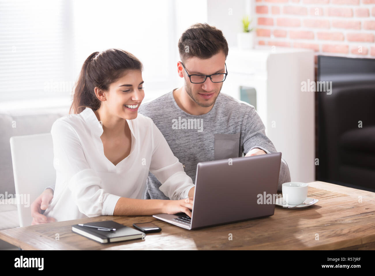 Teens two looking at watch hi-res stock photography and images - Alamy
