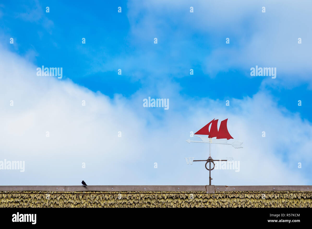 wind indicator in the form of a sailing ship on a roof Stock Photo - Alamy