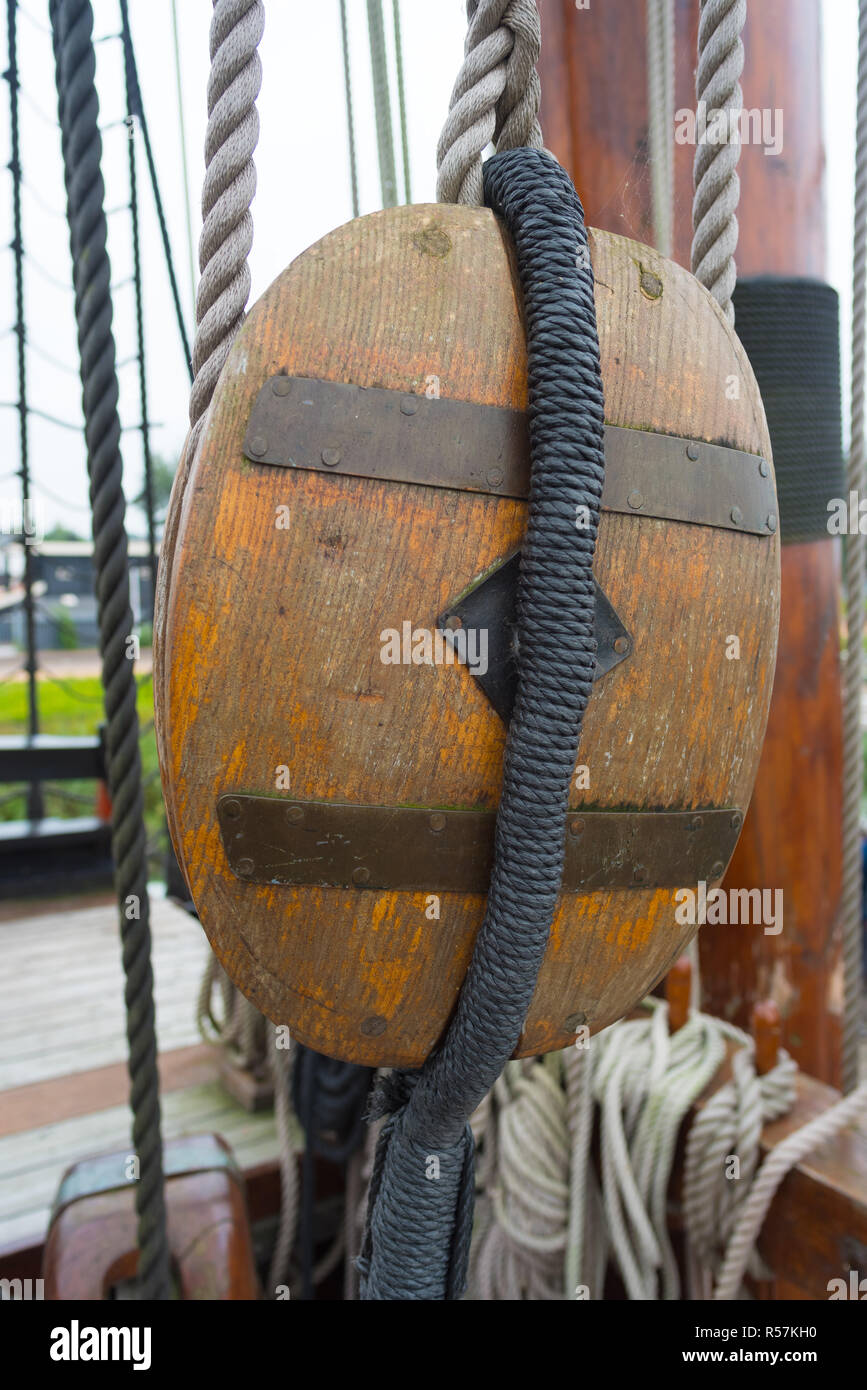 old wooden pulley Stock Photo - Alamy