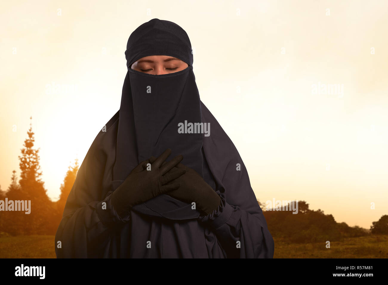Beautiful asian muslim female in veil with niqab standing Stock Photo ...