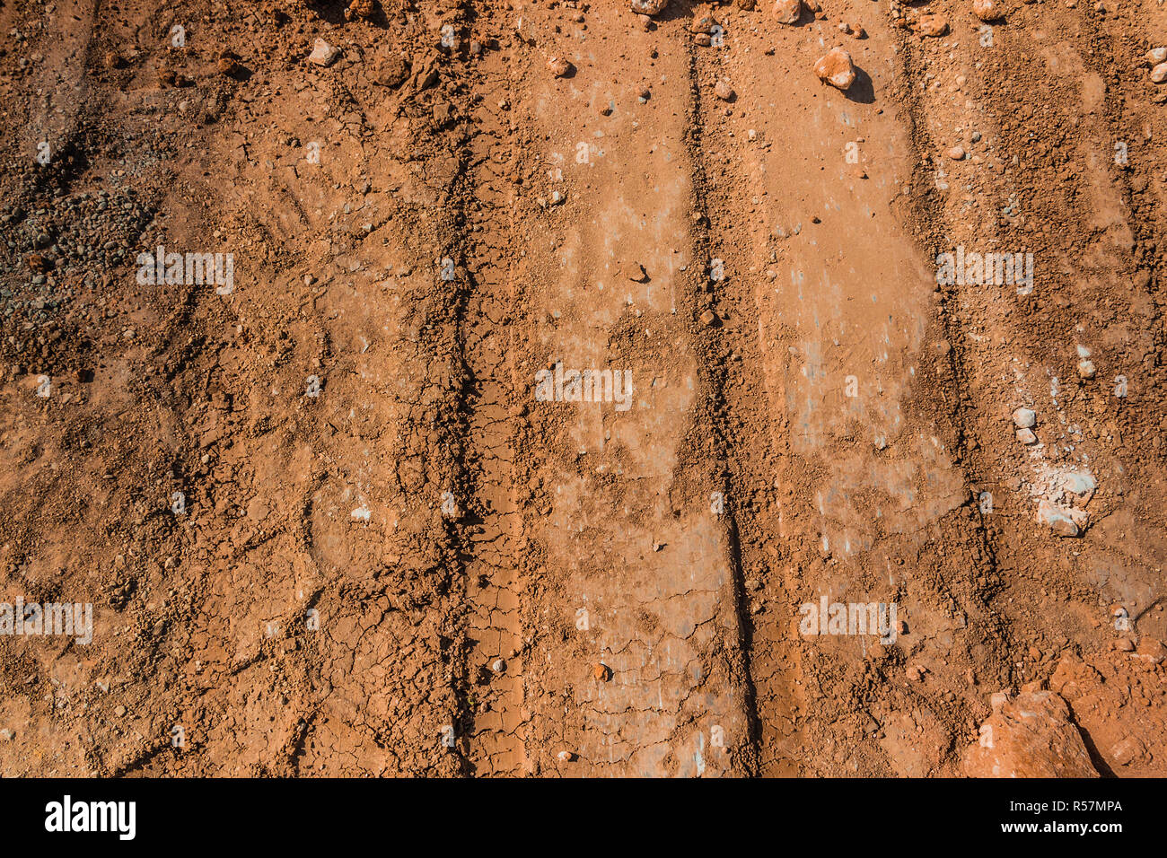 Texture of brown dirt with tractor tyre tracks Stock Photo - Alamy