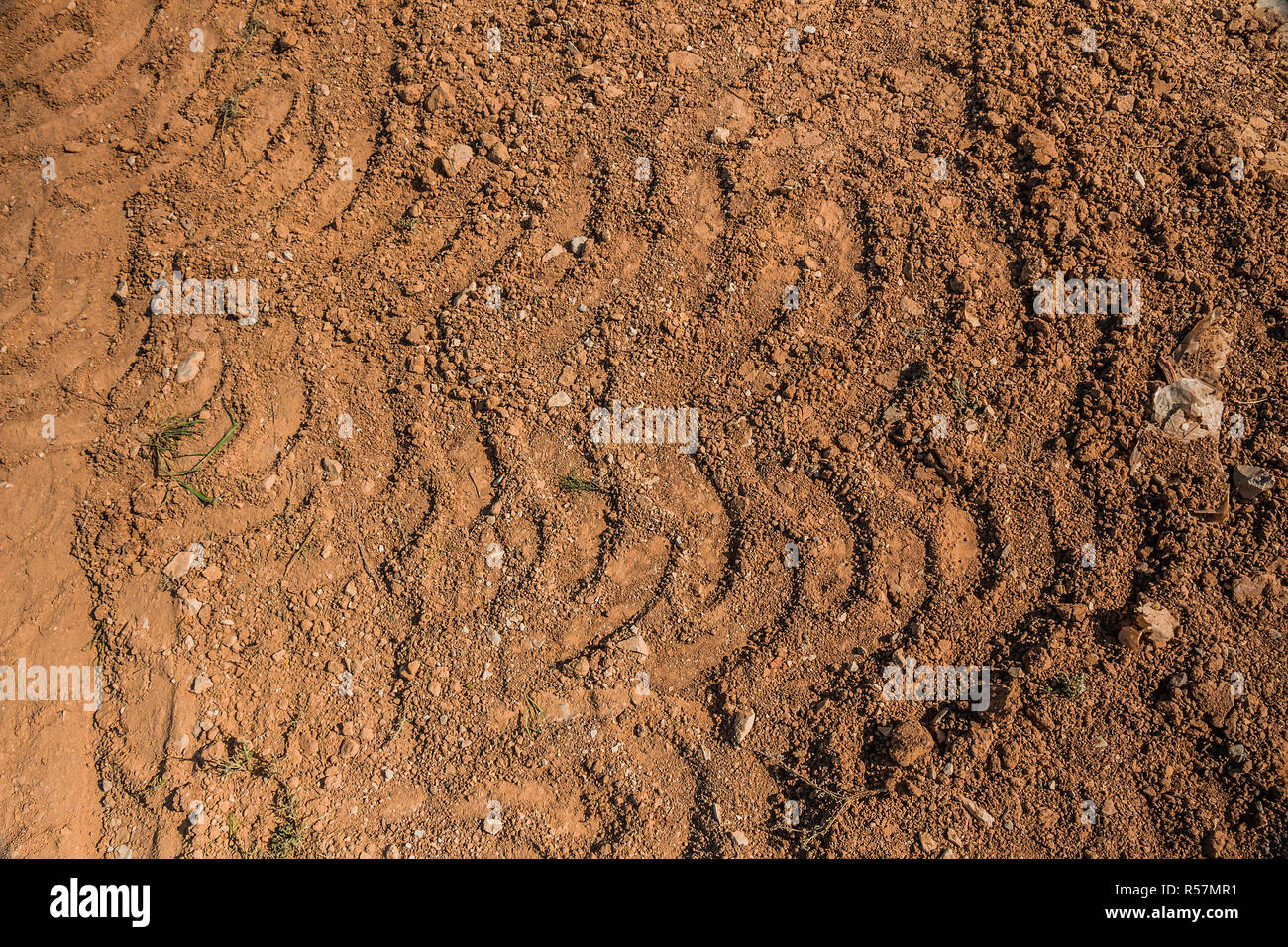 Texture of brown dirt with tractor tyre tracks Stock Photo - Alamy