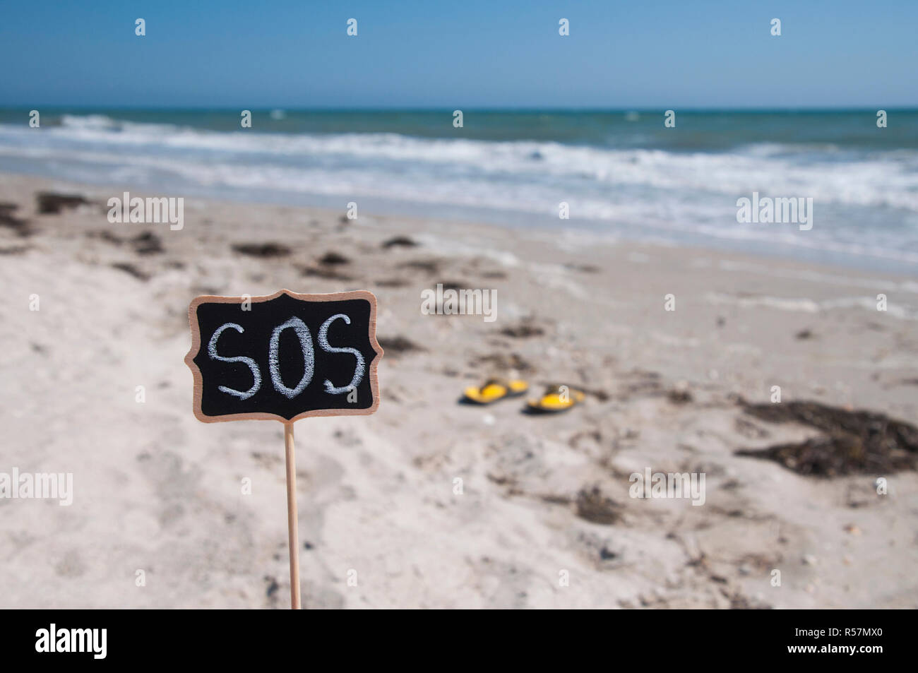 Wooden plaque with an inscription SOS Stock Photo - Alamy