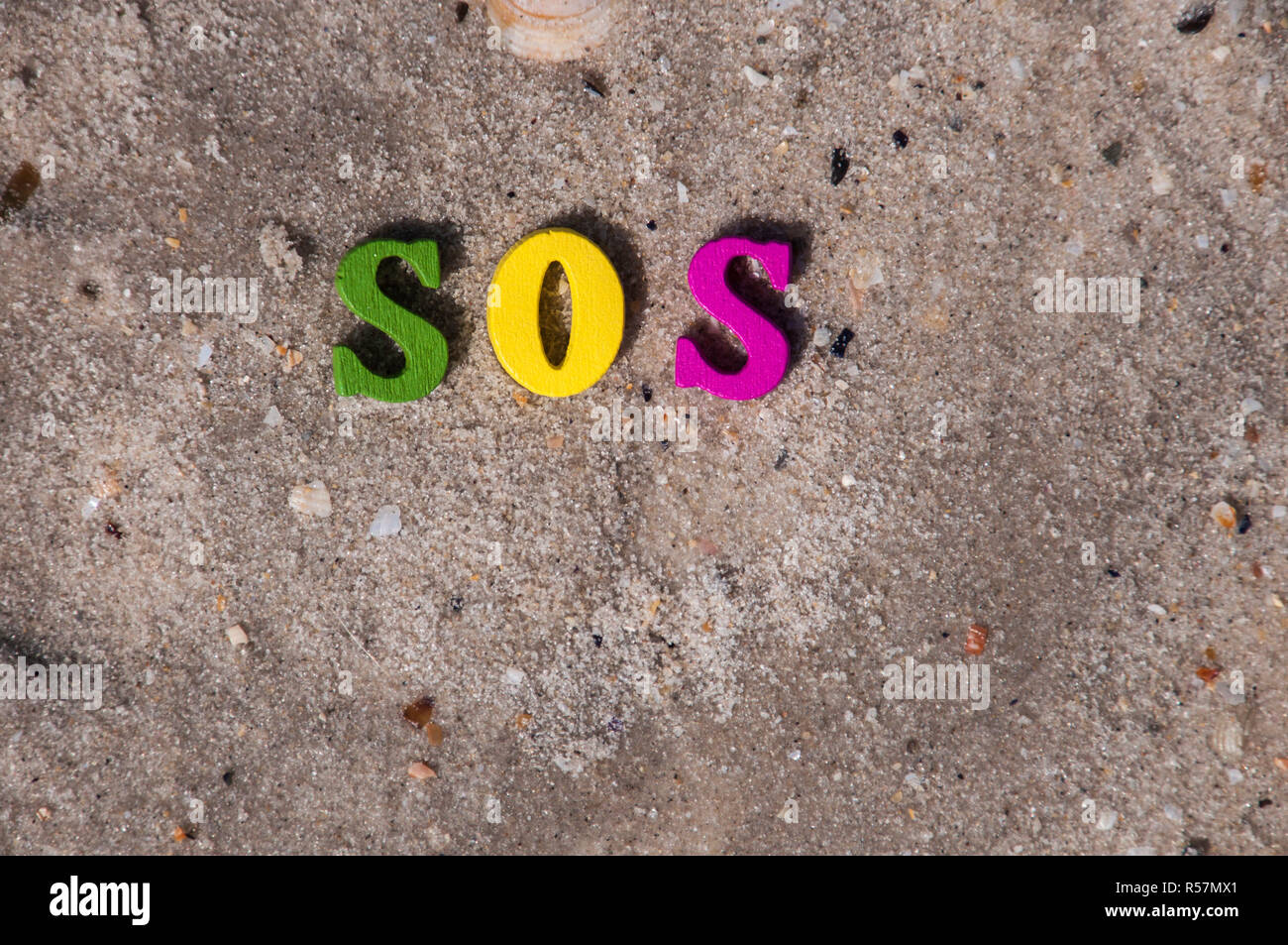 word sos from wooden letters Stock Photo - Alamy