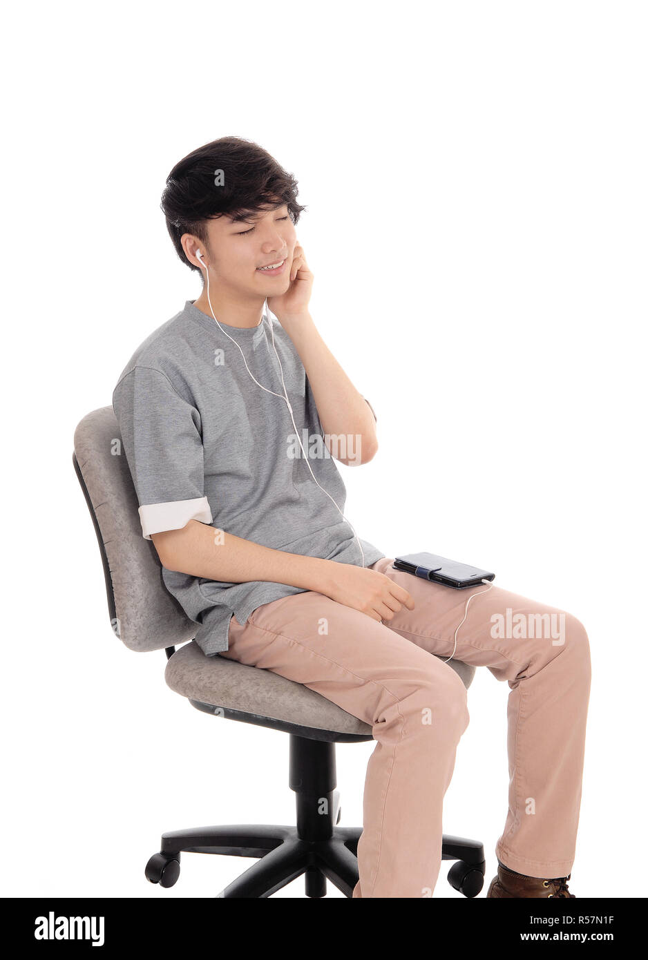 Thoughtful asian man listening hi-res stock photography and images - Alamy