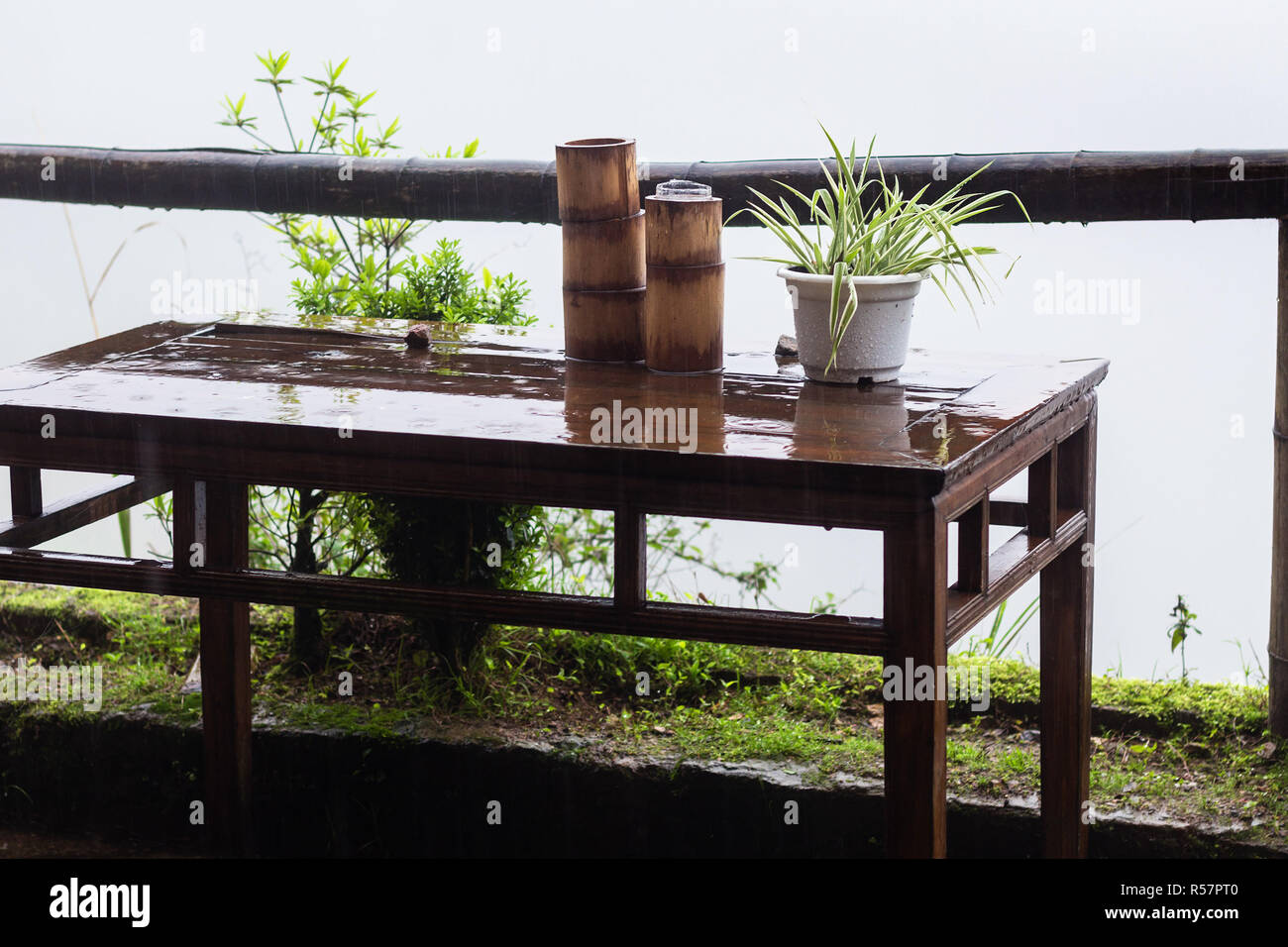 wet table on terrace in village in spring rain Stock Photo - Alamy