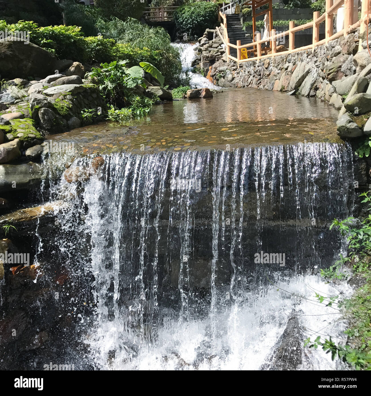 waterfall with warm water from hot spring Stock Photo - Alamy