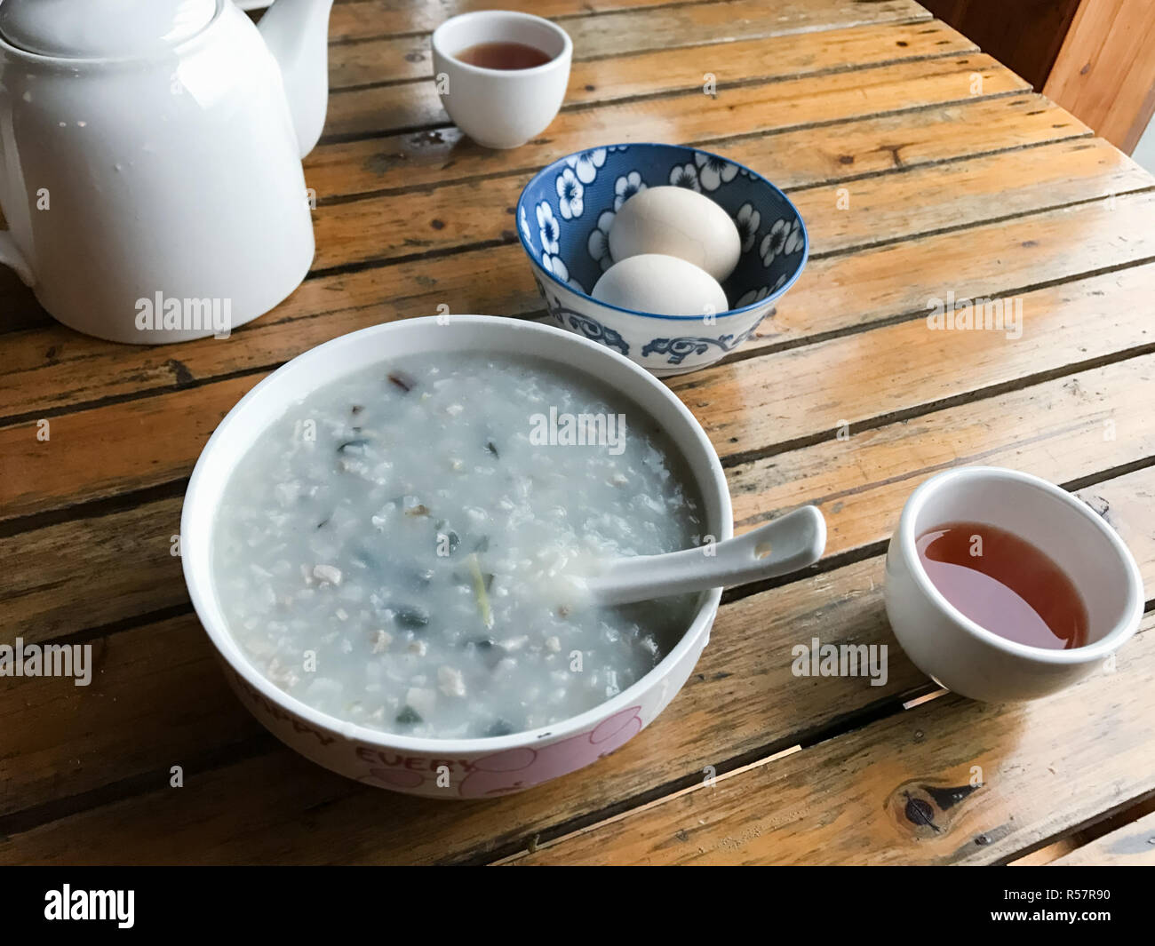 served local chinese breakfast in rustic eatery Stock Photo - Alamy