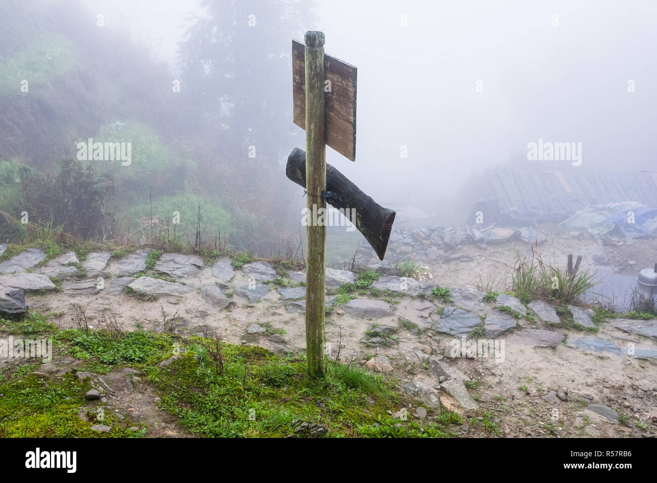 waymark on mountain path in misty spring day Stock Photo - Alamy