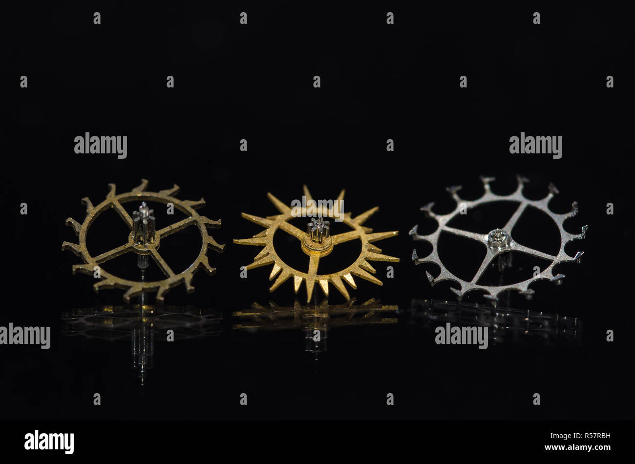 Watch Parts: Variety of Escape Wheels on Black Background Stock Photo ...
