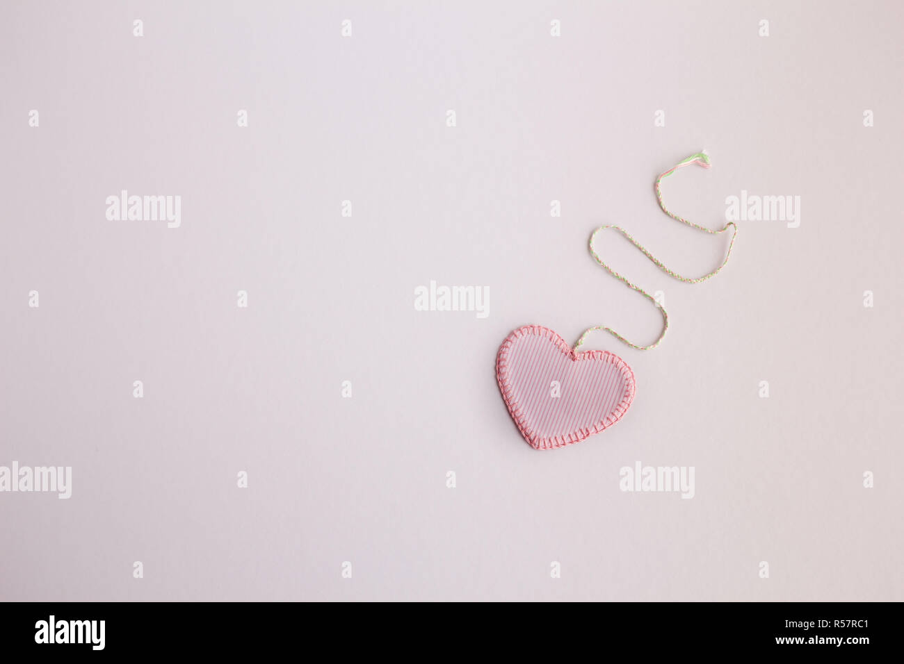 Heart-shaped cloth patch on white background Stock Photo - Alamy