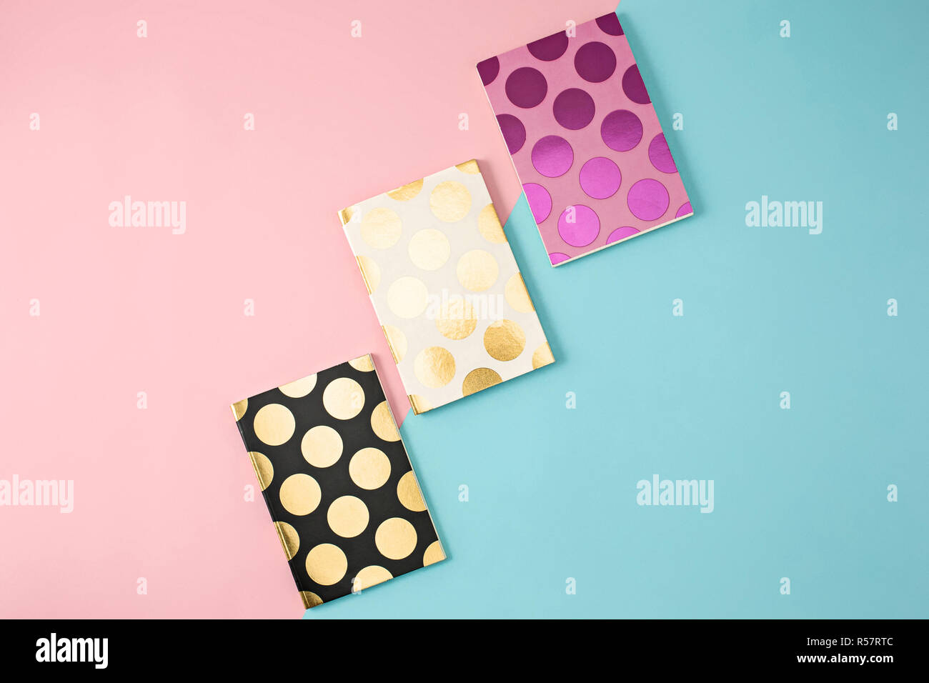 The three notebooks on colorful baground Stock Photo - Alamy