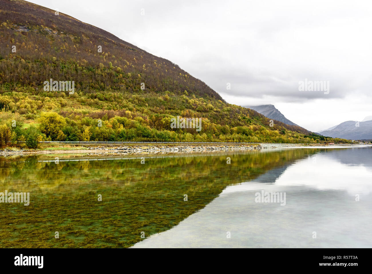 mountains reflecting in clear water, Norway Stock Photo - Alamy