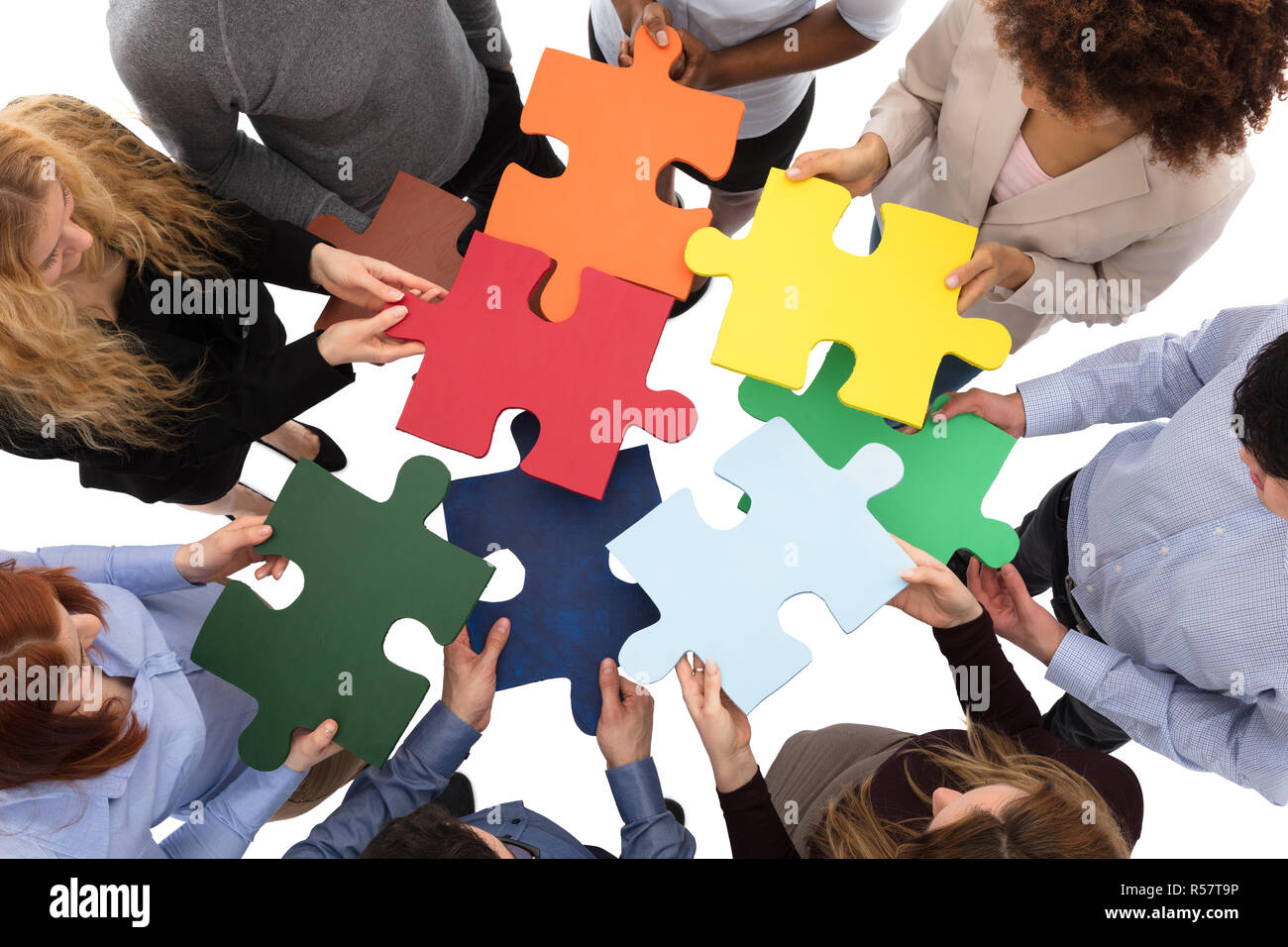 Group Of College Students Solving Puzzle Stock Photo - Alamy