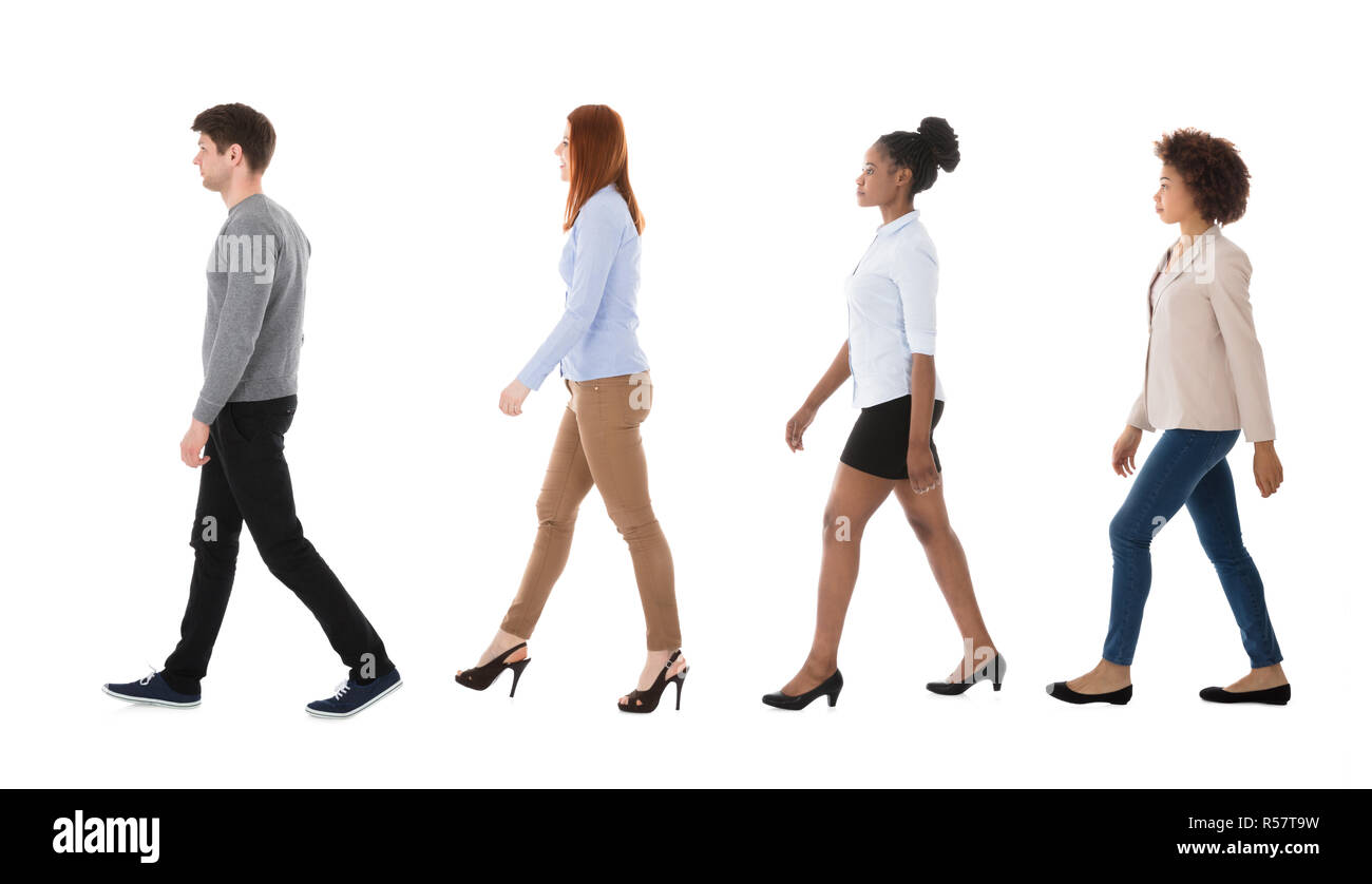 Male And Female College Students Walking In Row Stock Photo - Alamy