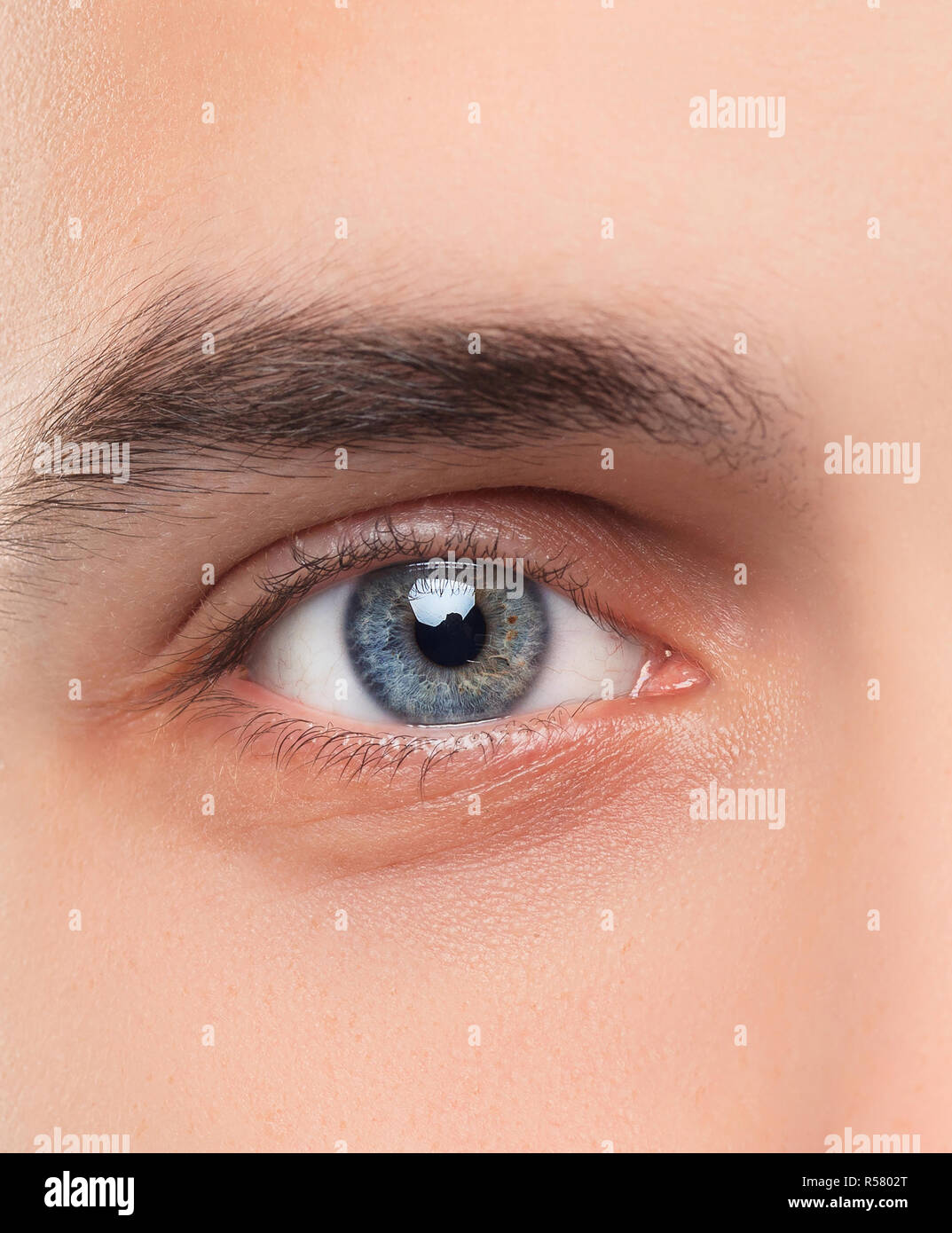 Beautiful blue man eyes close up Stock Photo - Alamy