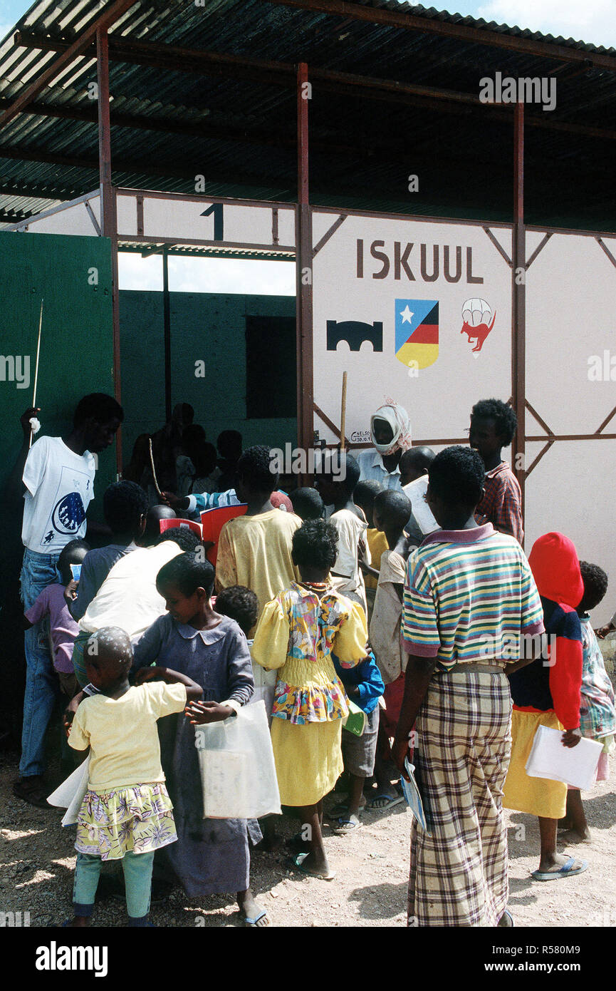 1993 - Children gather outside of a school house in Belet Uen, Somalia ...
