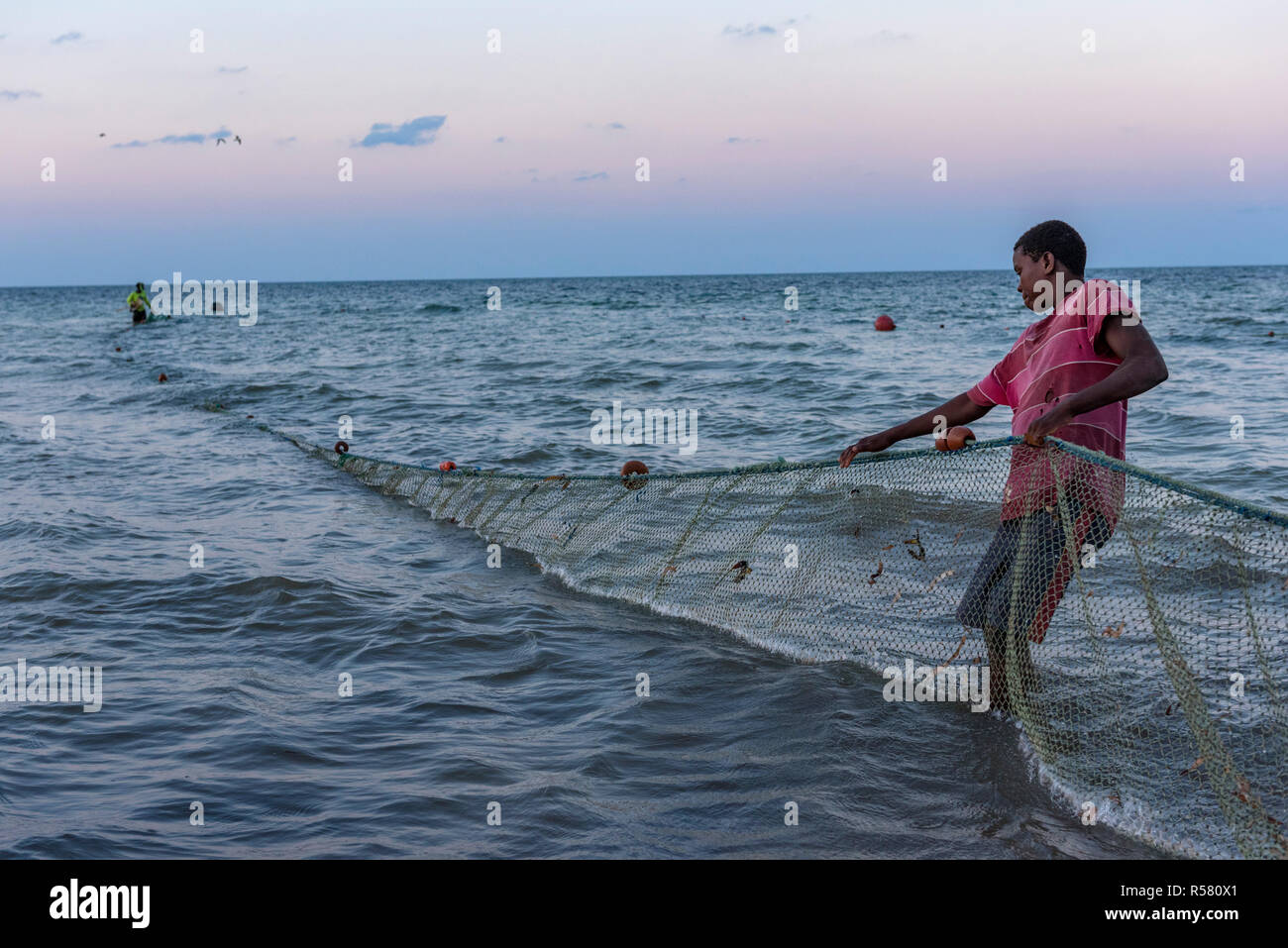 Fishermen hauling in nets sea hi-res stock photography and images - Alamy