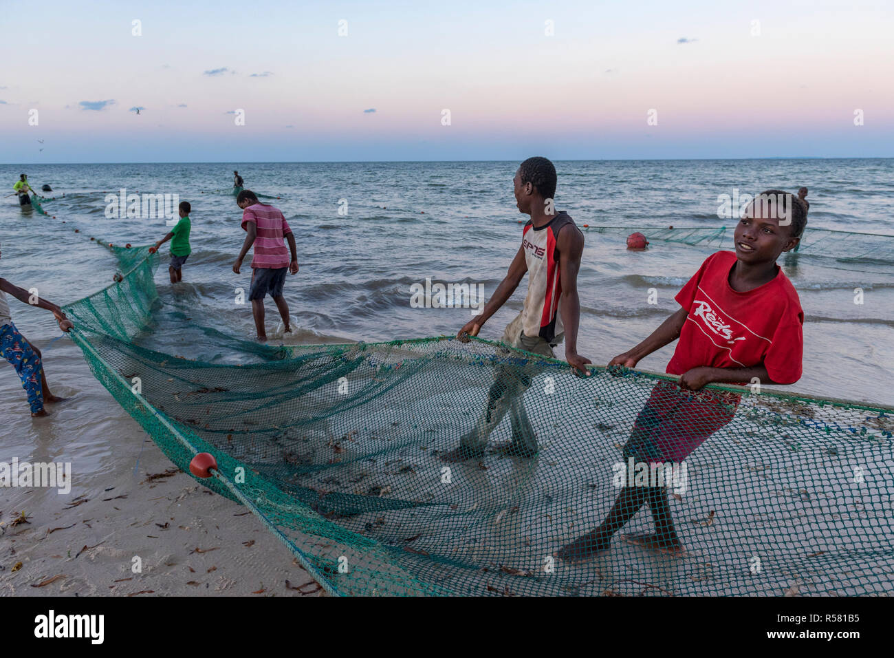 Fishermen hauling in nets sea hi-res stock photography and images - Alamy