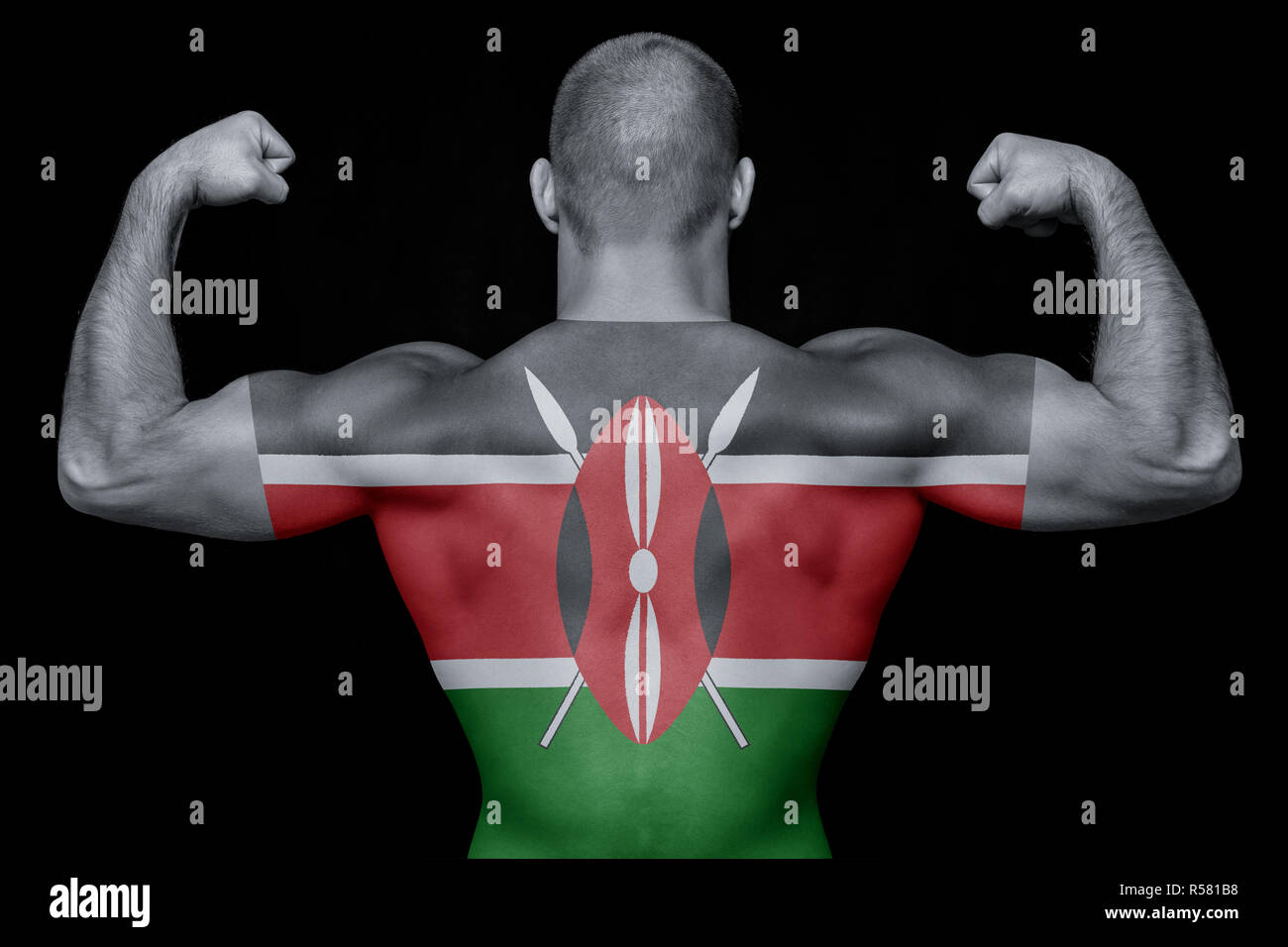 The back of a young sports man wearing a T-shirt with the national flag ...