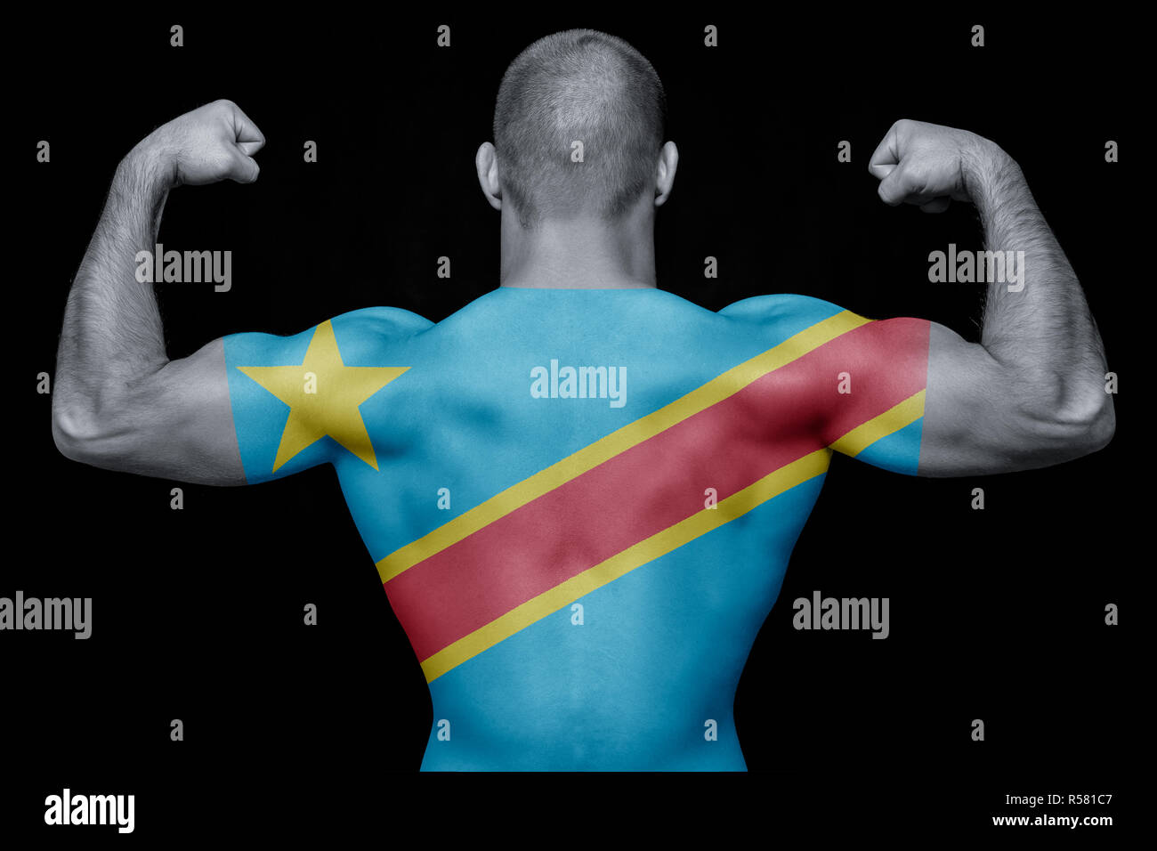 The back of a young athletic man wearing a T-shirt with the national ...