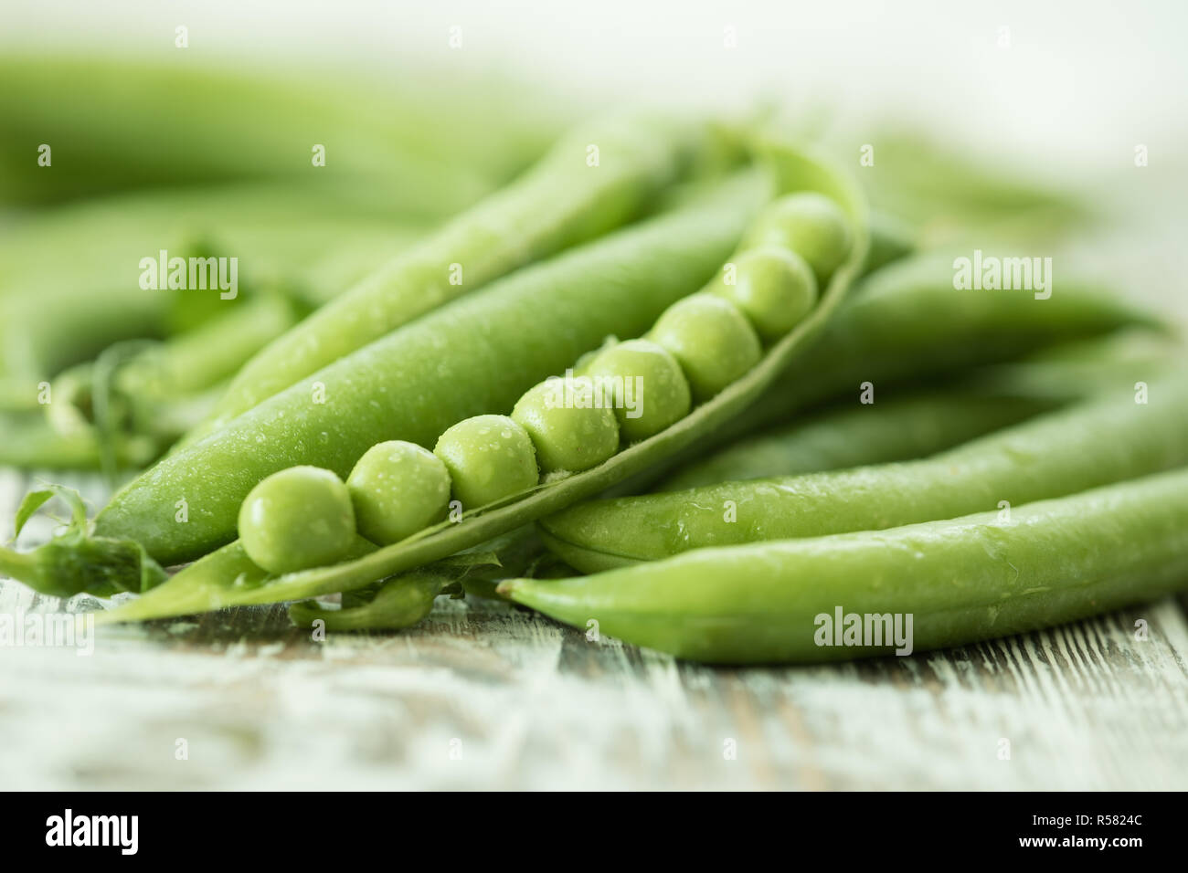 green pea pod, green peas. Vegetable background Stock Photo - Alamy