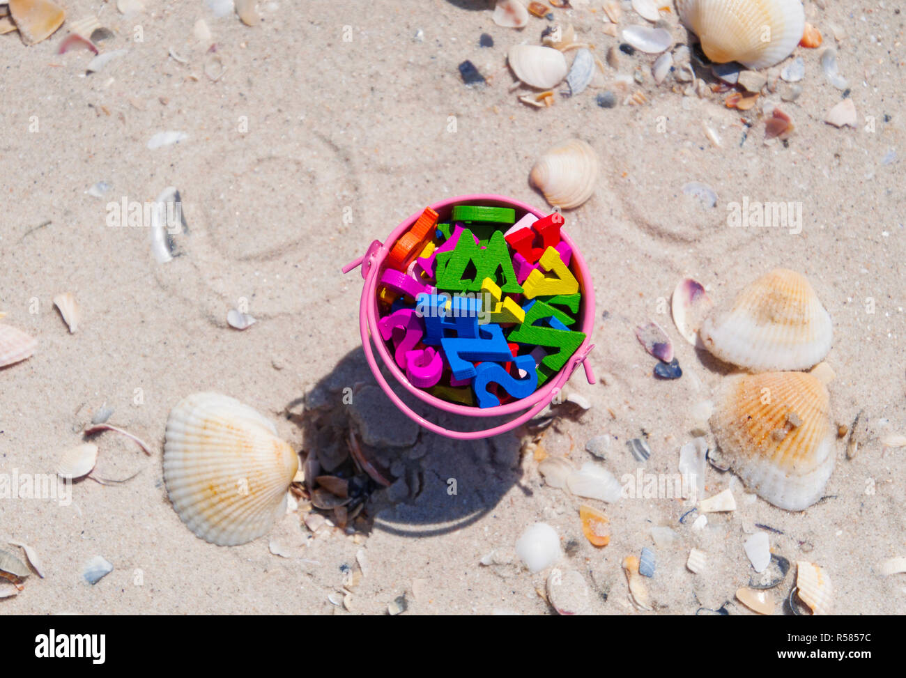 bucket full of wooden multicolored letters Stock Photo - Alamy