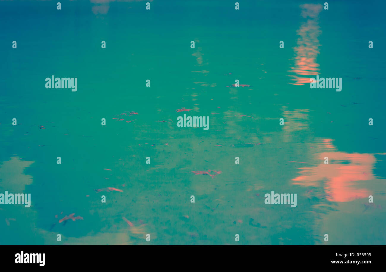 Water in different colors of blue, pink and orange Stock Photo - Alamy