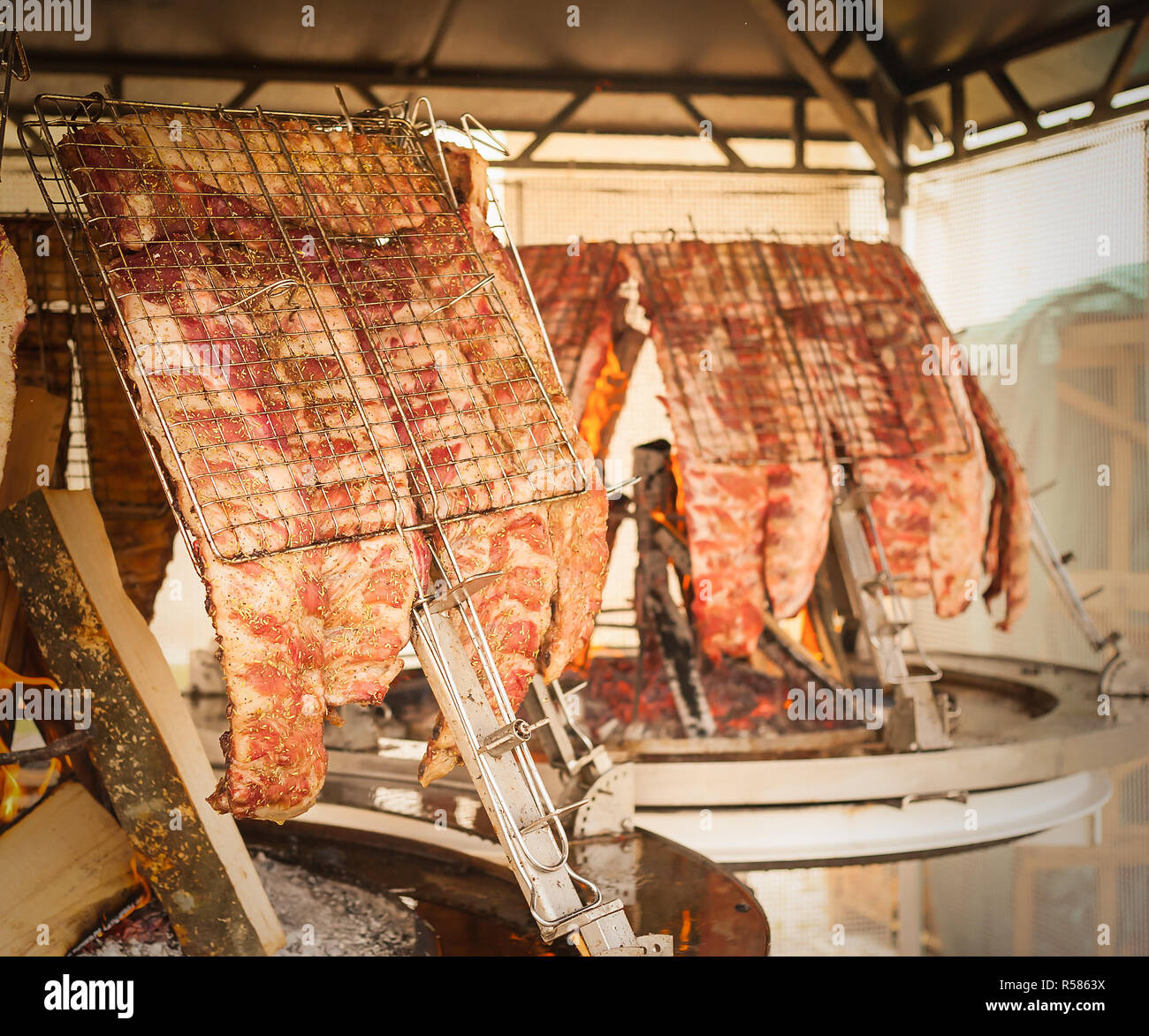 Roasted meat of beef cooked on a vertical grills Stock Photo - Alamy