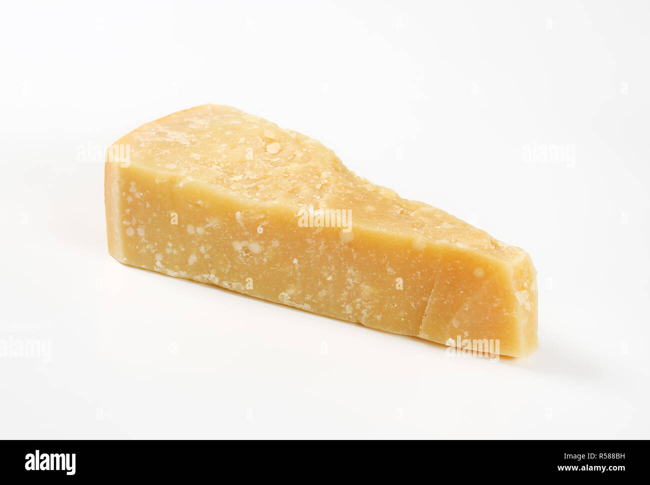 Parmesan cheese wedge Stock Photo - Alamy