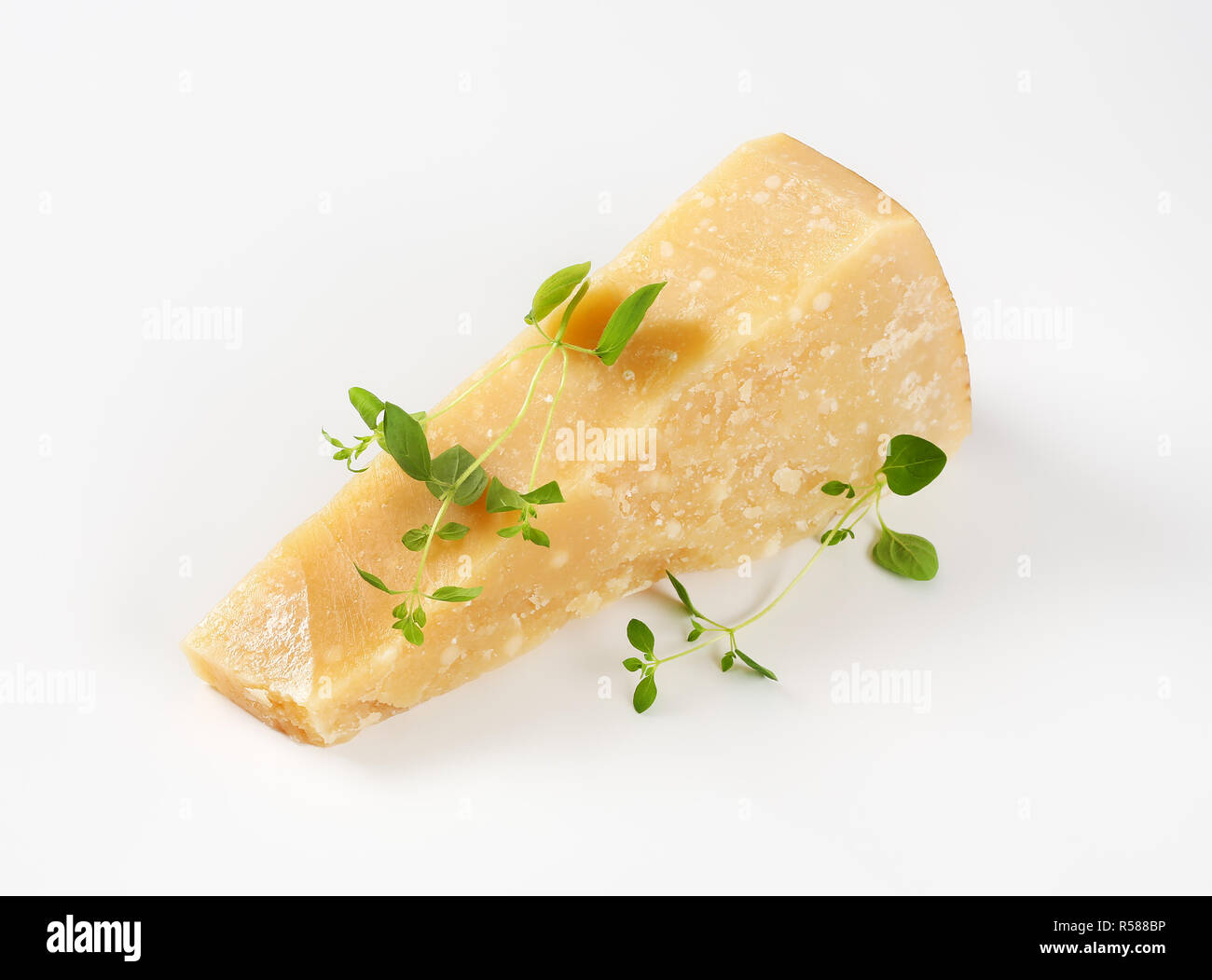 Parmesan cheese wedge Stock Photo - Alamy