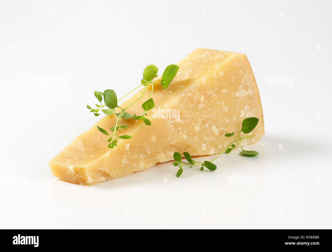 Parmesan cheese wedge Stock Photo - Alamy