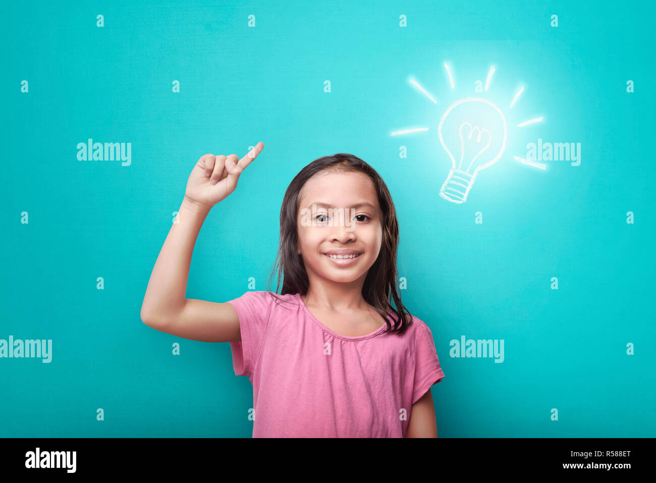 Clever asian child with bright idea symbol above her head Stock Photo ...