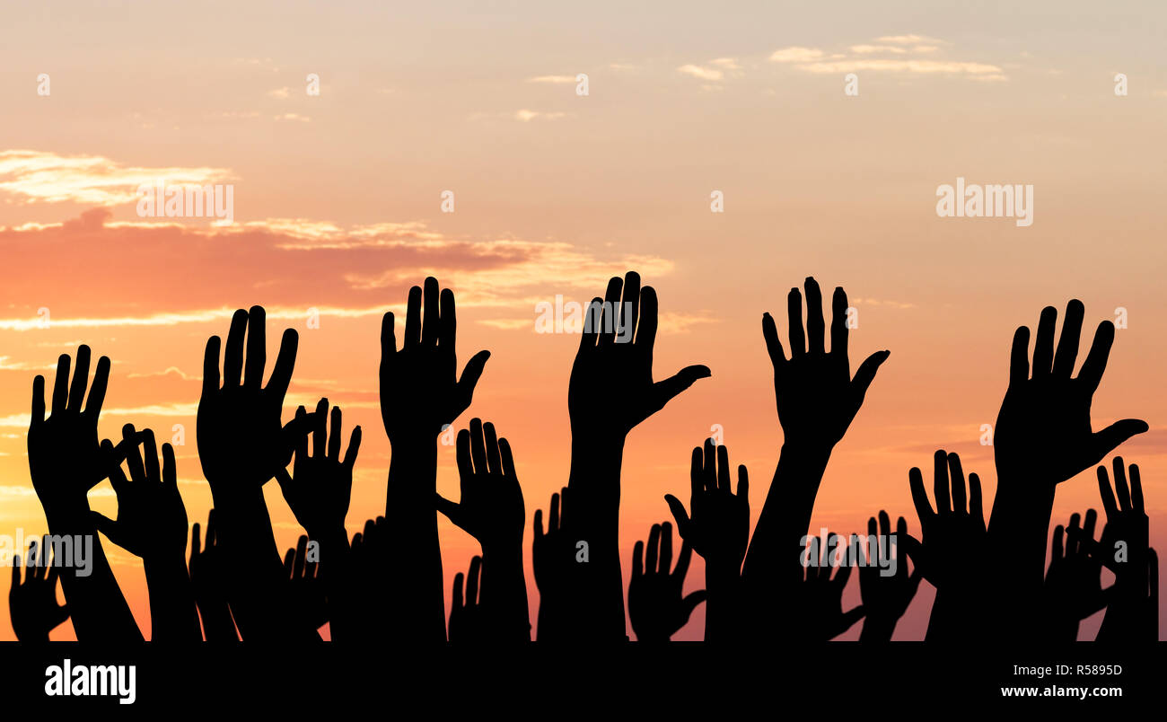 Silhouette Of Raised Hands Stock Photo - Alamy