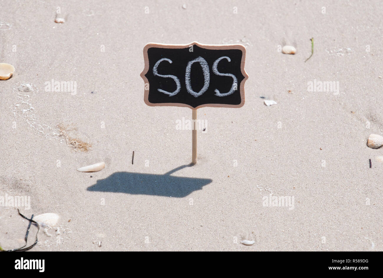 black wooden plaque with an inscription the SOS Stock Photo - Alamy