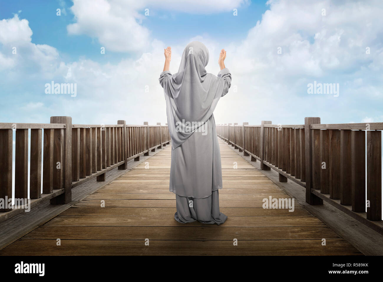 Back view of asian muslim girl standing and praying to god Stock Photo ...