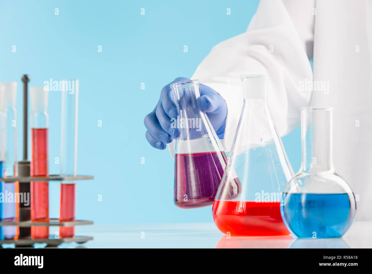 Experiments in a chemistry lab. conducting an experiment in the ...