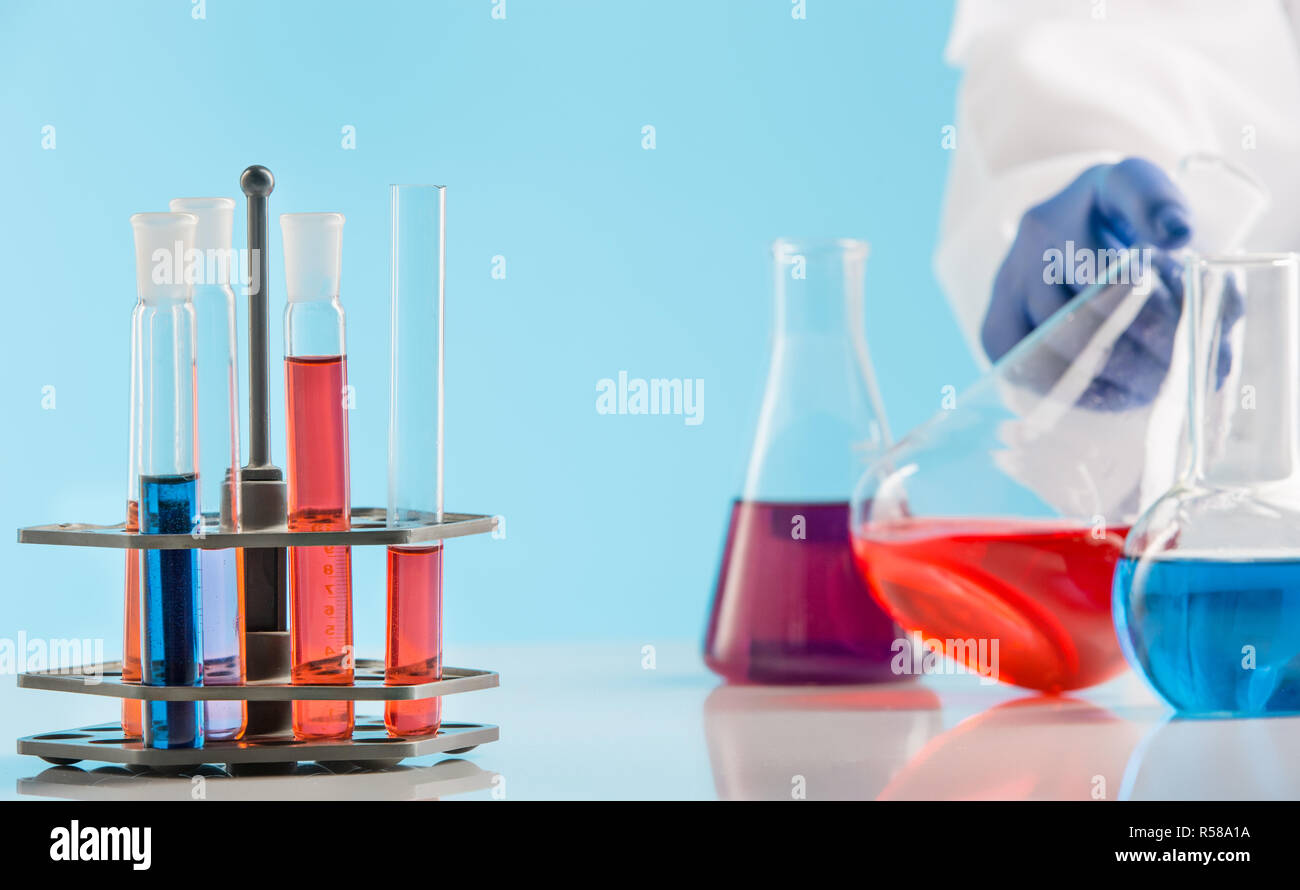 Experiments in a chemistry lab. conducting an experiment in the ...