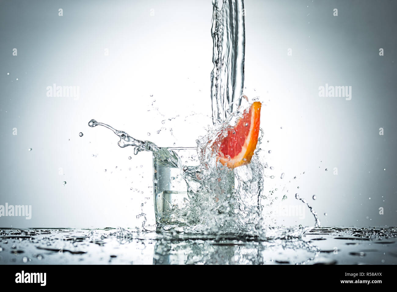 water splash in glass of gray color Stock Photo - Alamy