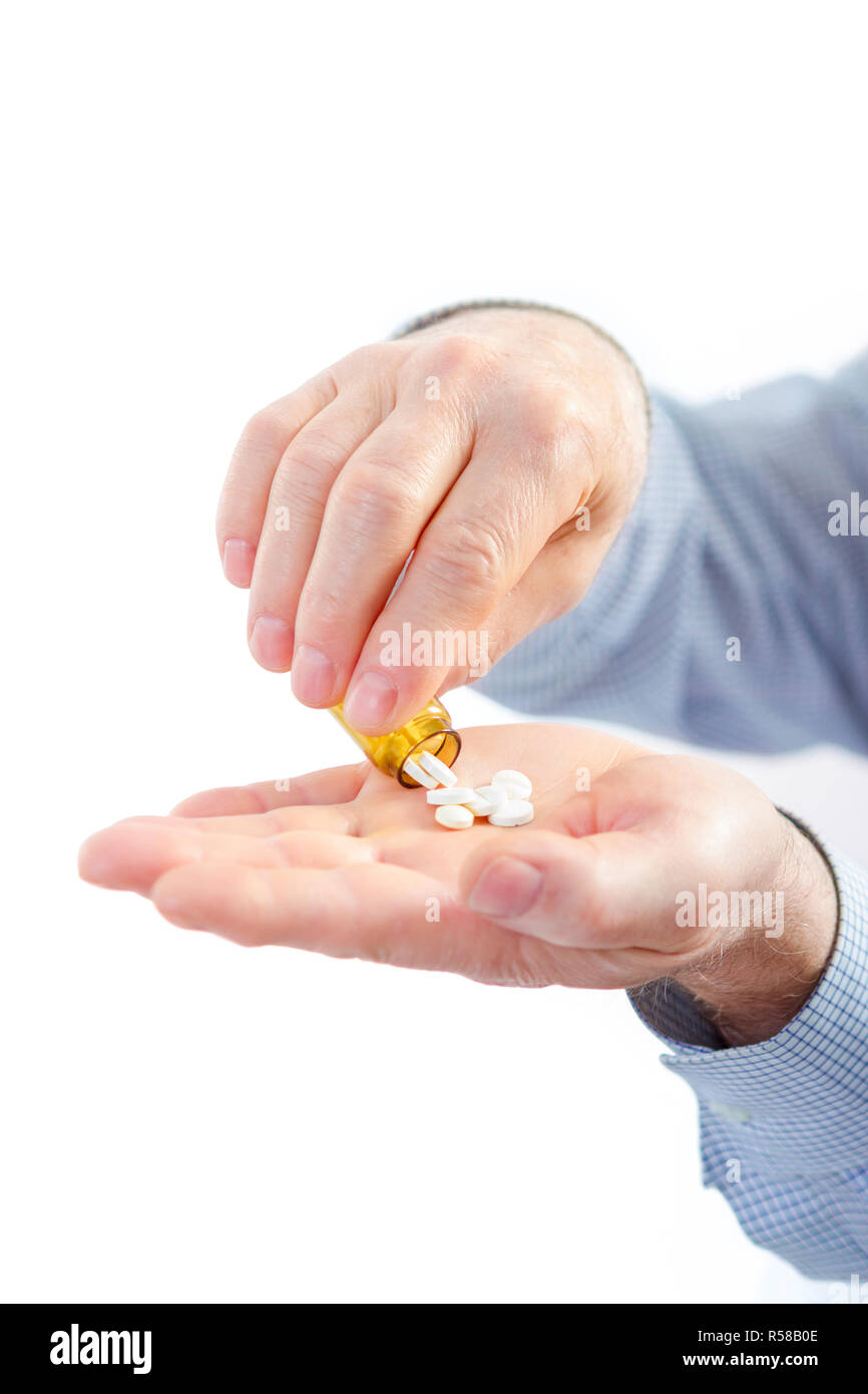 Senior adult man holds medicine capsule Stock Photo - Alamy