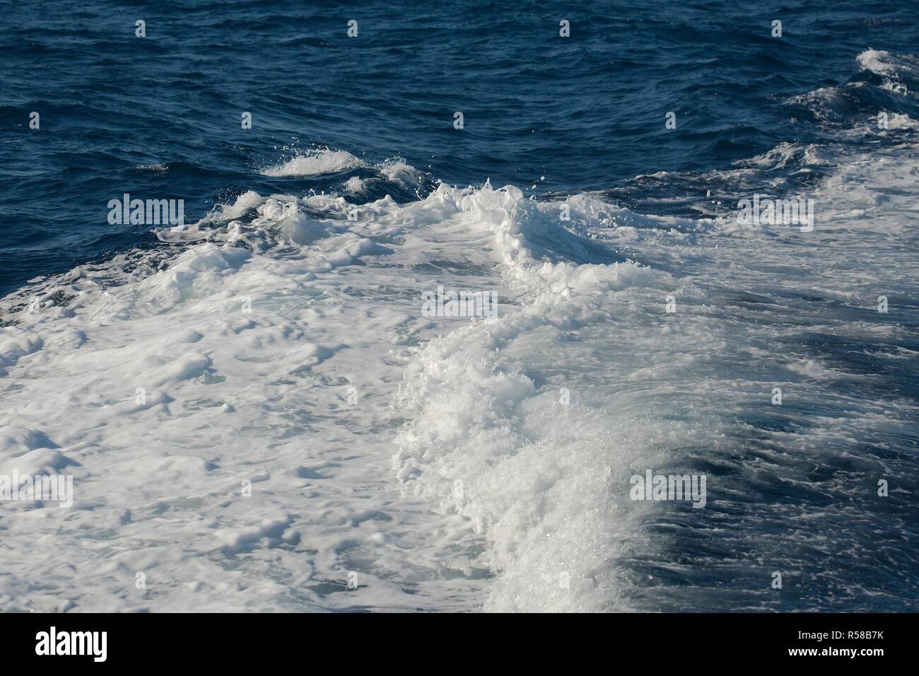 Waves hitting shore Stock Photo - Alamy