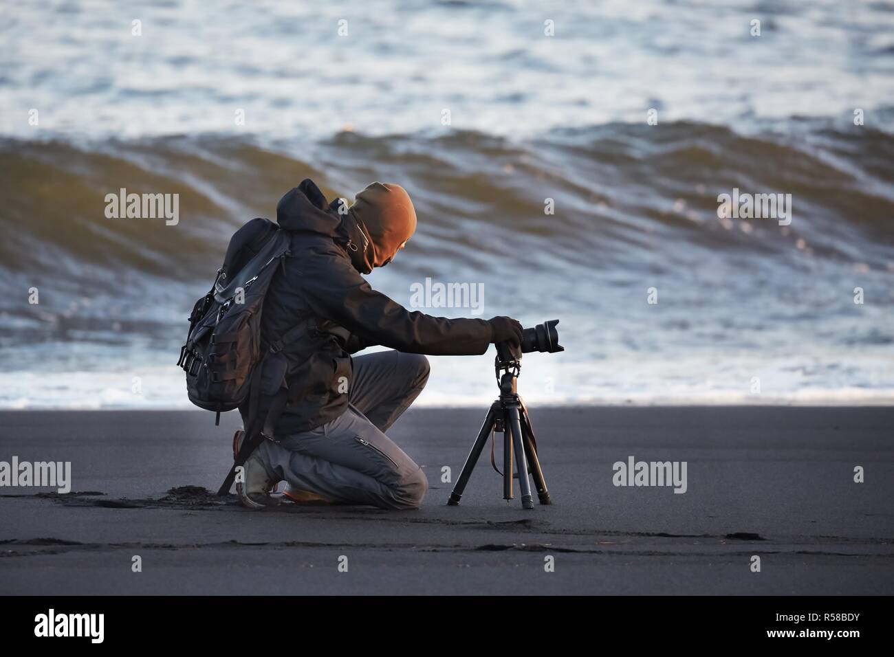 Photographer with tripod Stock Photo - Alamy