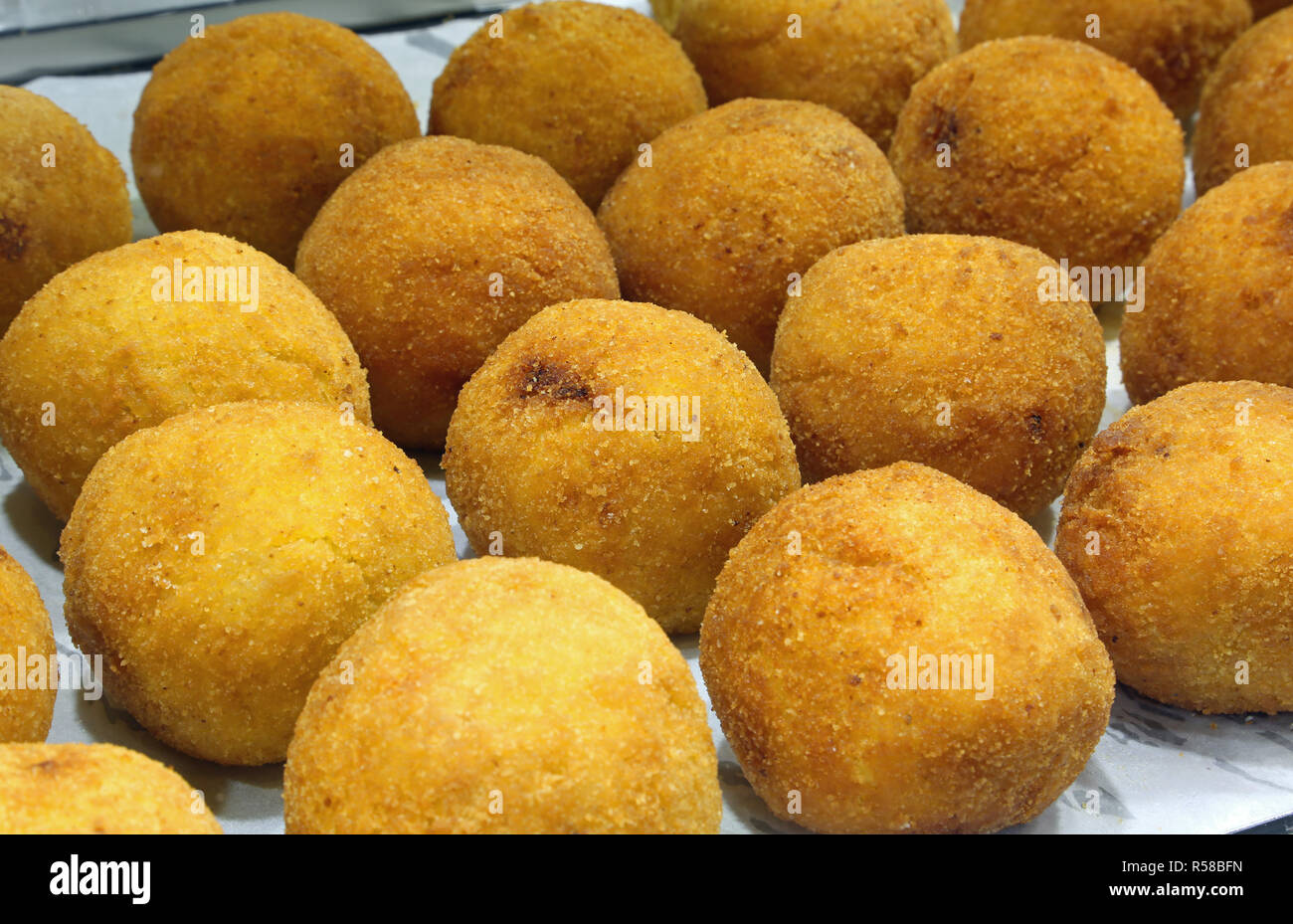 Sicilian croquettes of rice called arancini in italian language stuffed ...