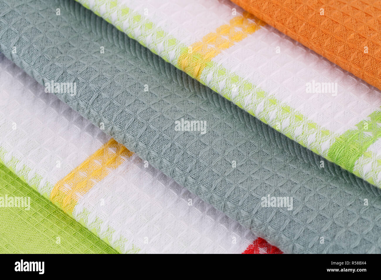 Stack of colorful kitchen towels closeup picture Stock Photo - Alamy