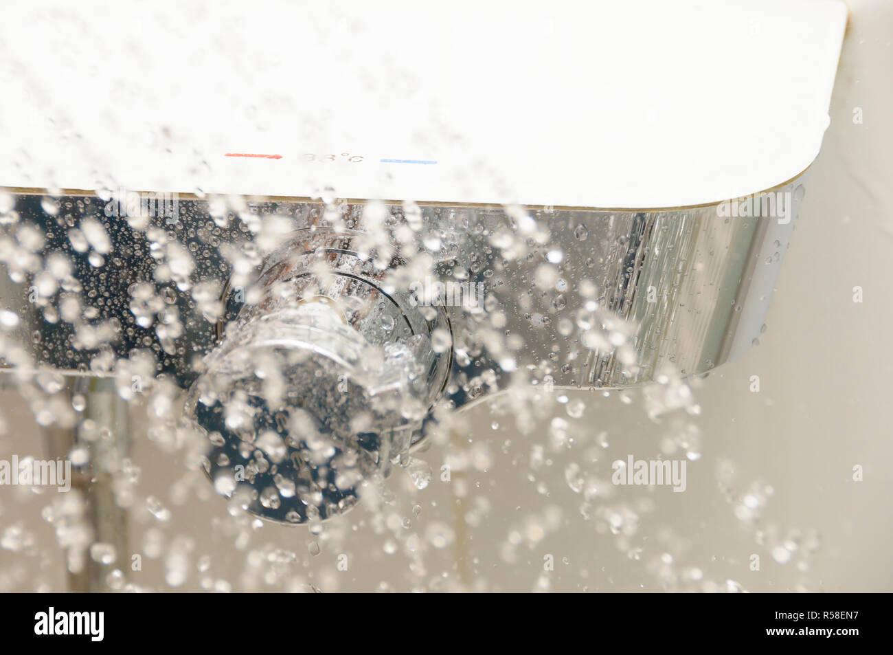 Running Water splashing out of a shower Stock Photo - Alamy
