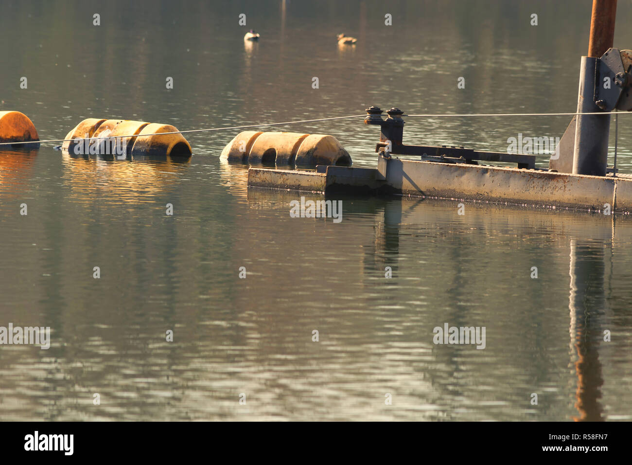 cable laying or piping in the water Stock Photo - Alamy