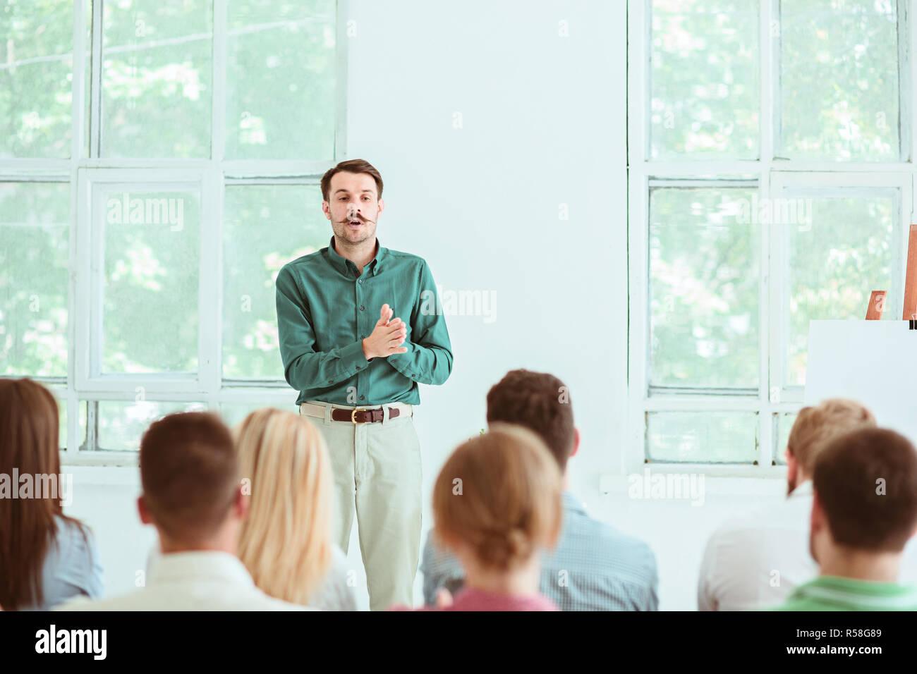 Speaker at Business Meeting in the conference hall Stock Photo - Alamy