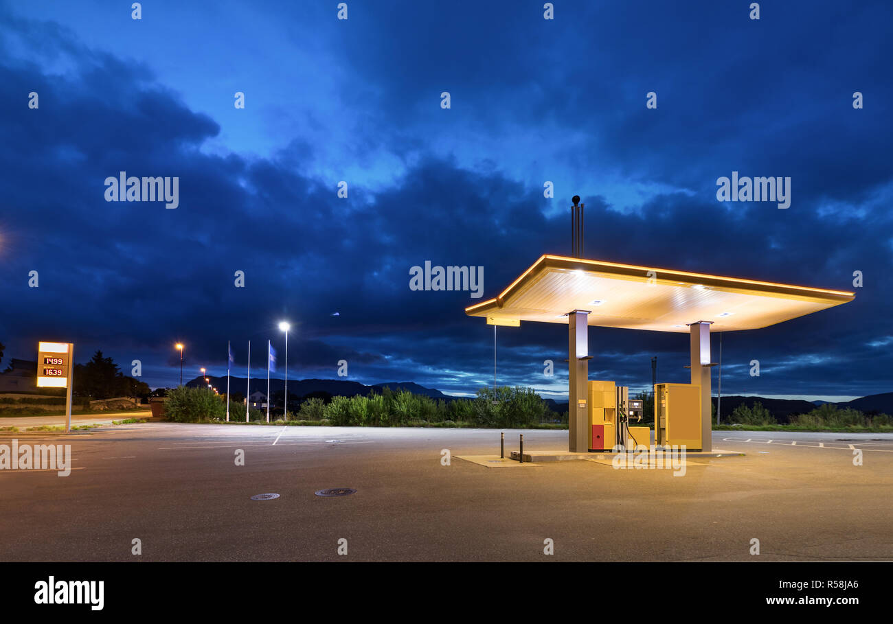 An empty fuel station at night in the summer of Bronnoysund, Norway ...