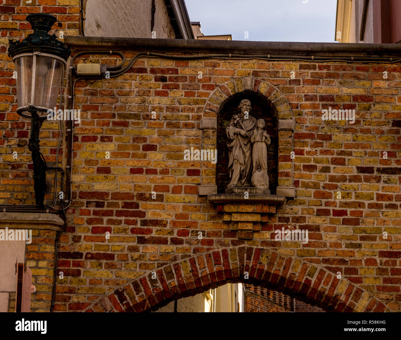 Christian sculpture on the facade of a house hi-res stock photography ...